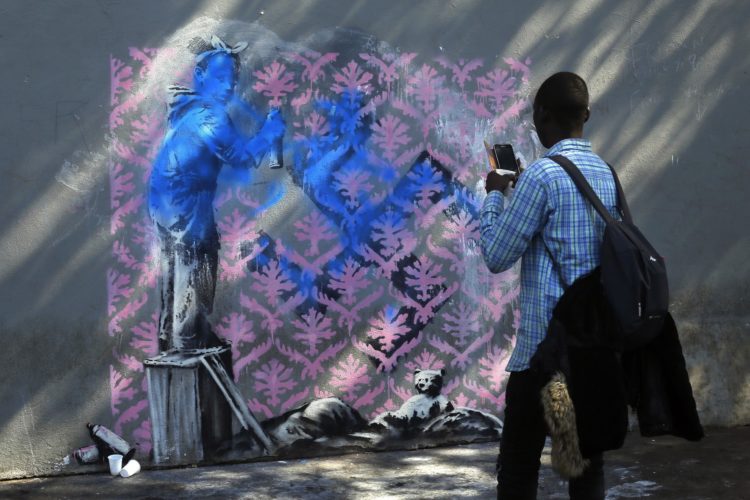 Banksy art on migrants spotted in Paris | News, Sports, Jobs - Altoona ...